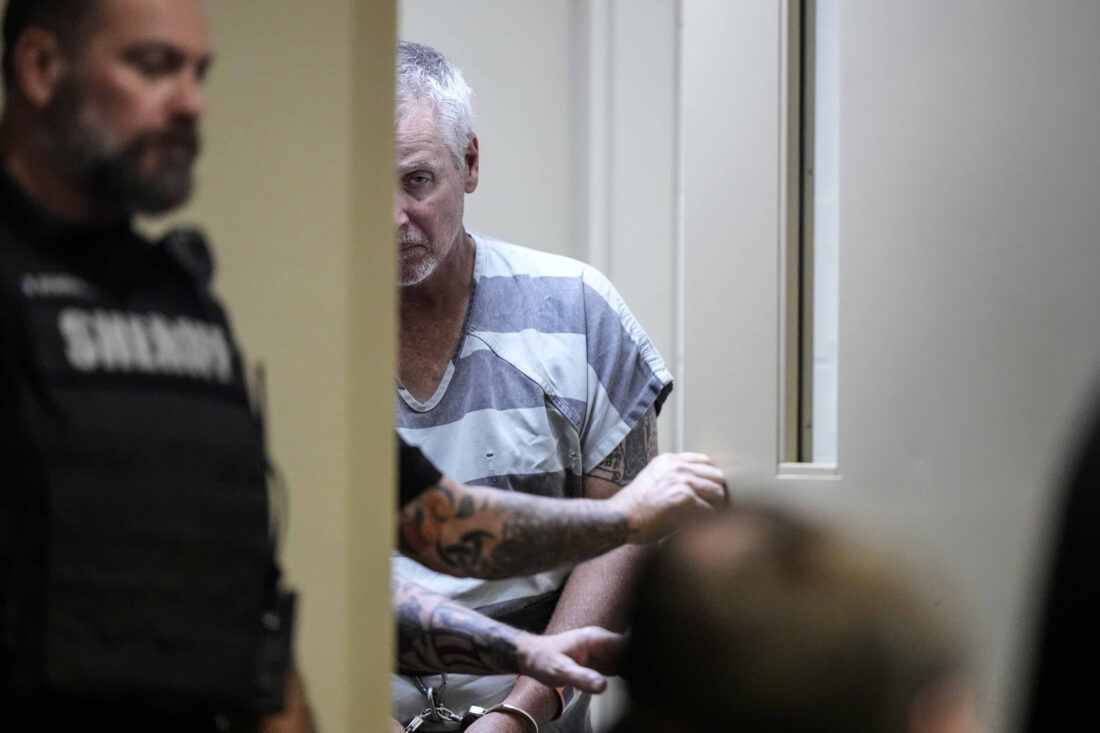 Teen, father charged in Georgia school shooting to remain in custody ...